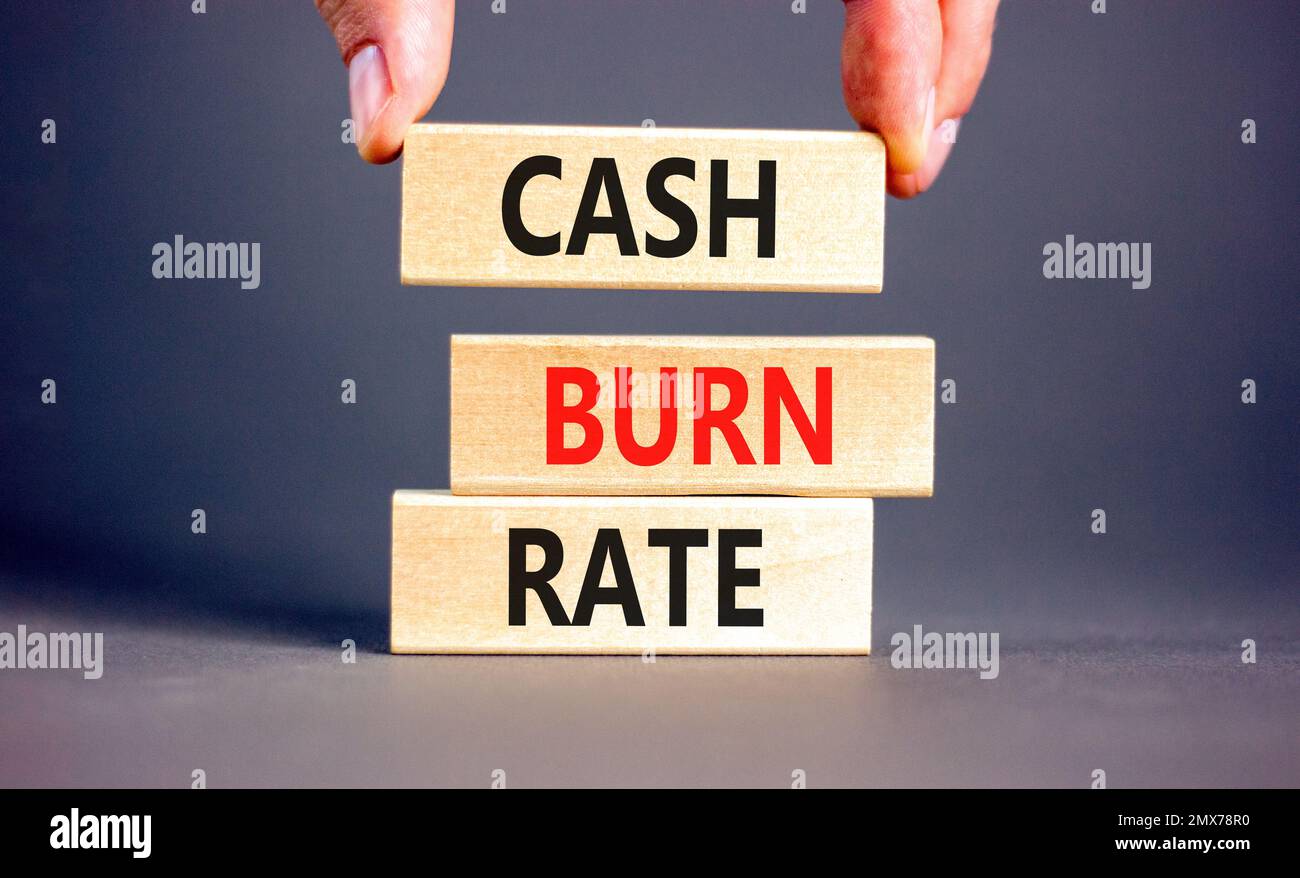 Cash burn rate symbol. Concept words Cash burn rate on wooden blocks on ...