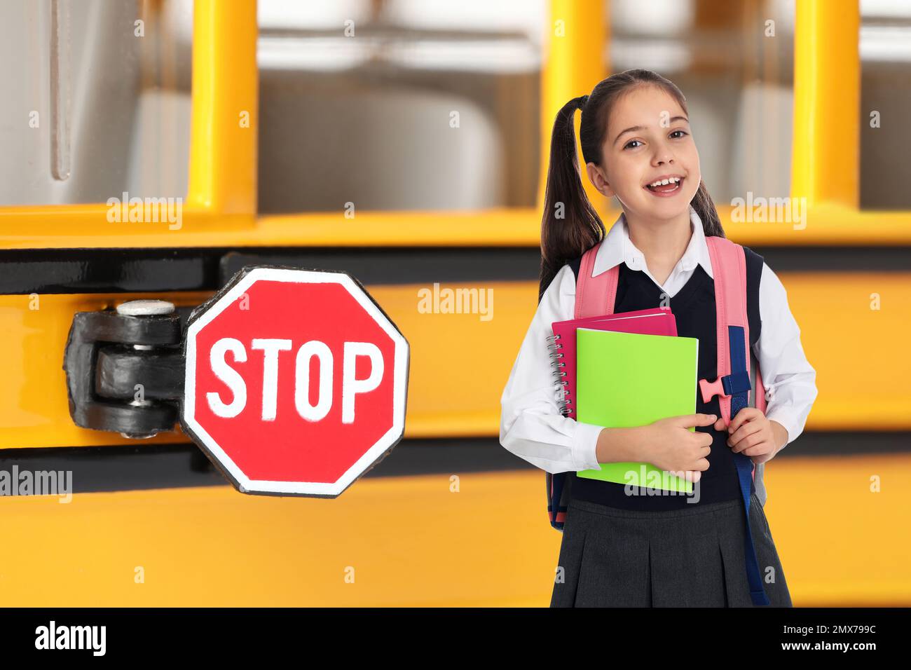 Girl with backpack near yellow school bus. Transport for students Stock ...