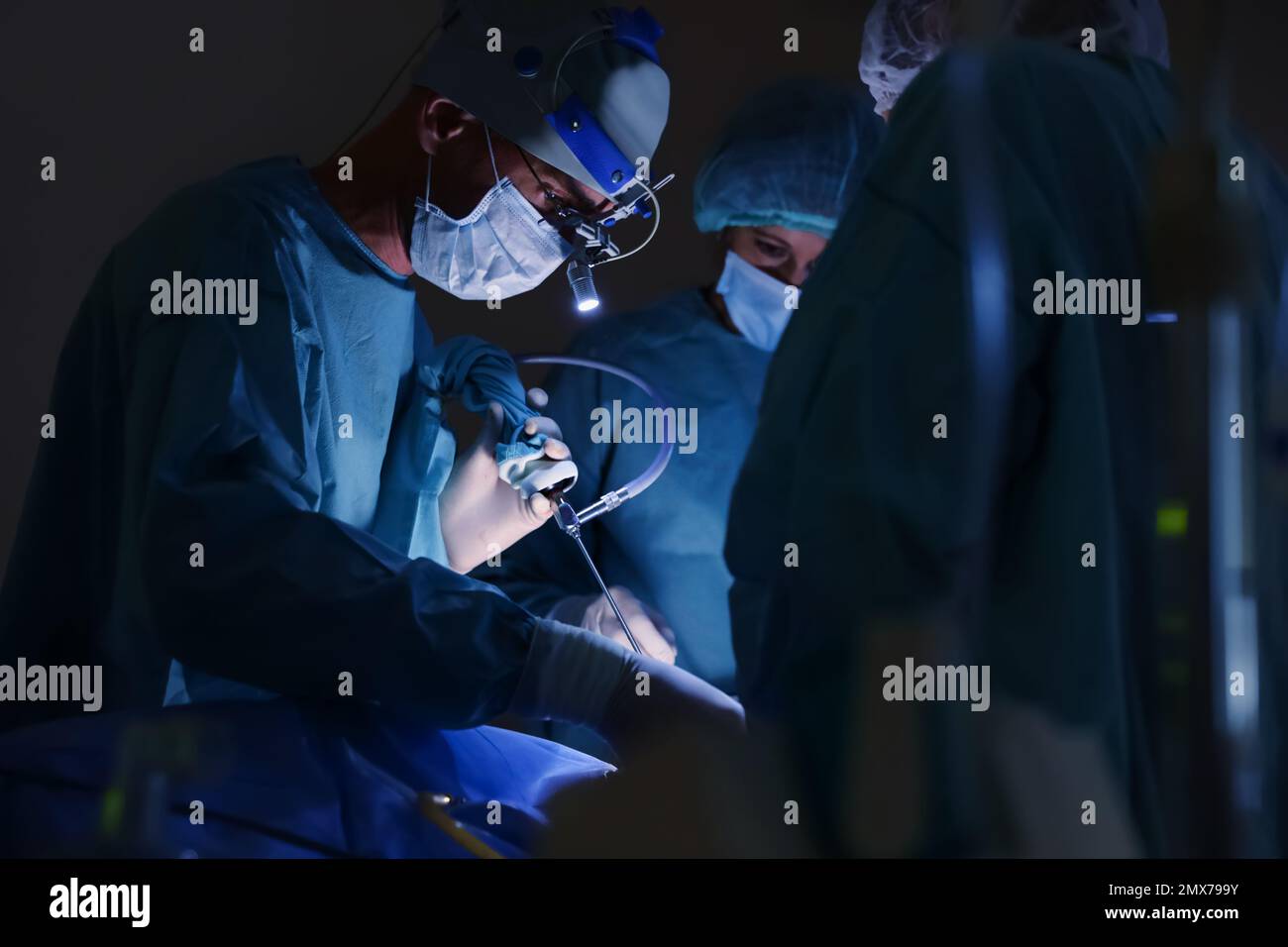 Team of professional doctors performing operation in surgery room Stock ...