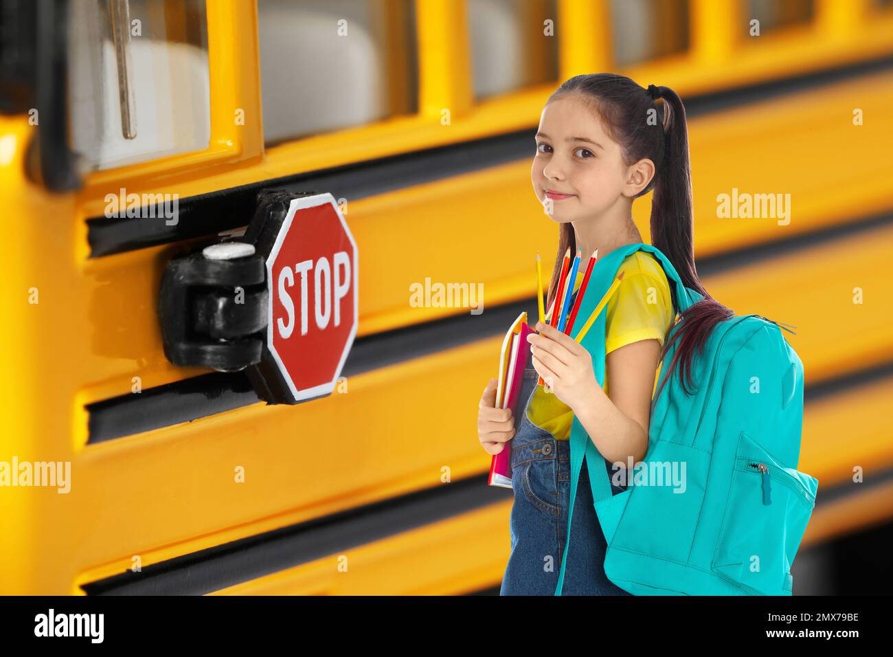 Girl with backpack near yellow school bus. Transport for students Stock ...