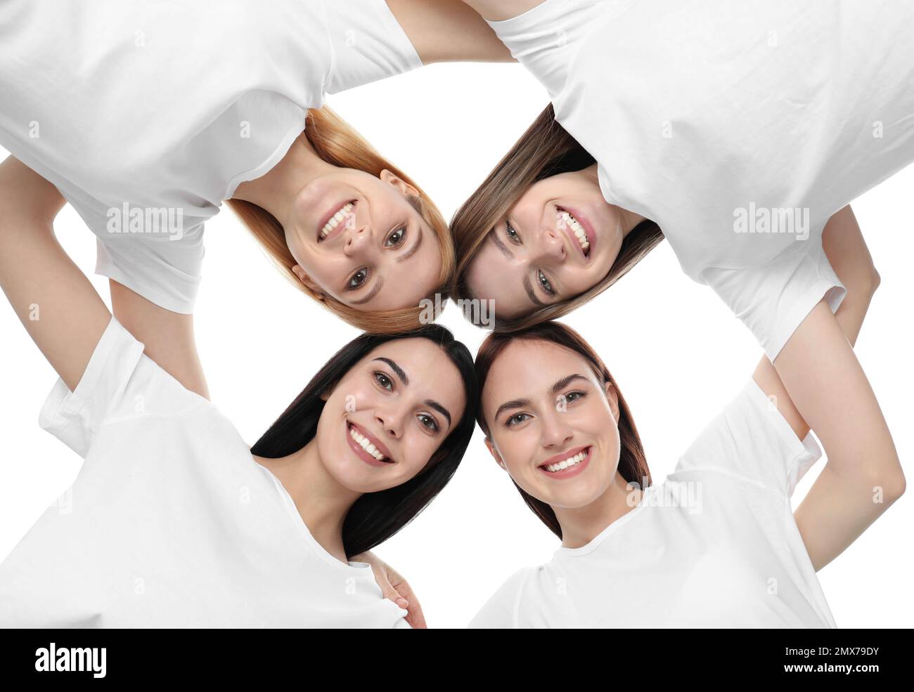 Beautiful young ladies hugging on white background, bottom view. Women ...