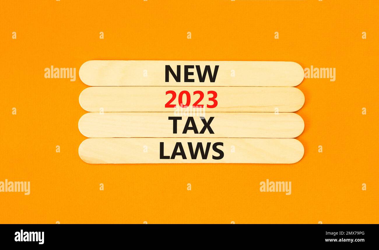 New 2023 tax laws symbol. Concept words New 2023 tax laws on wooden ...