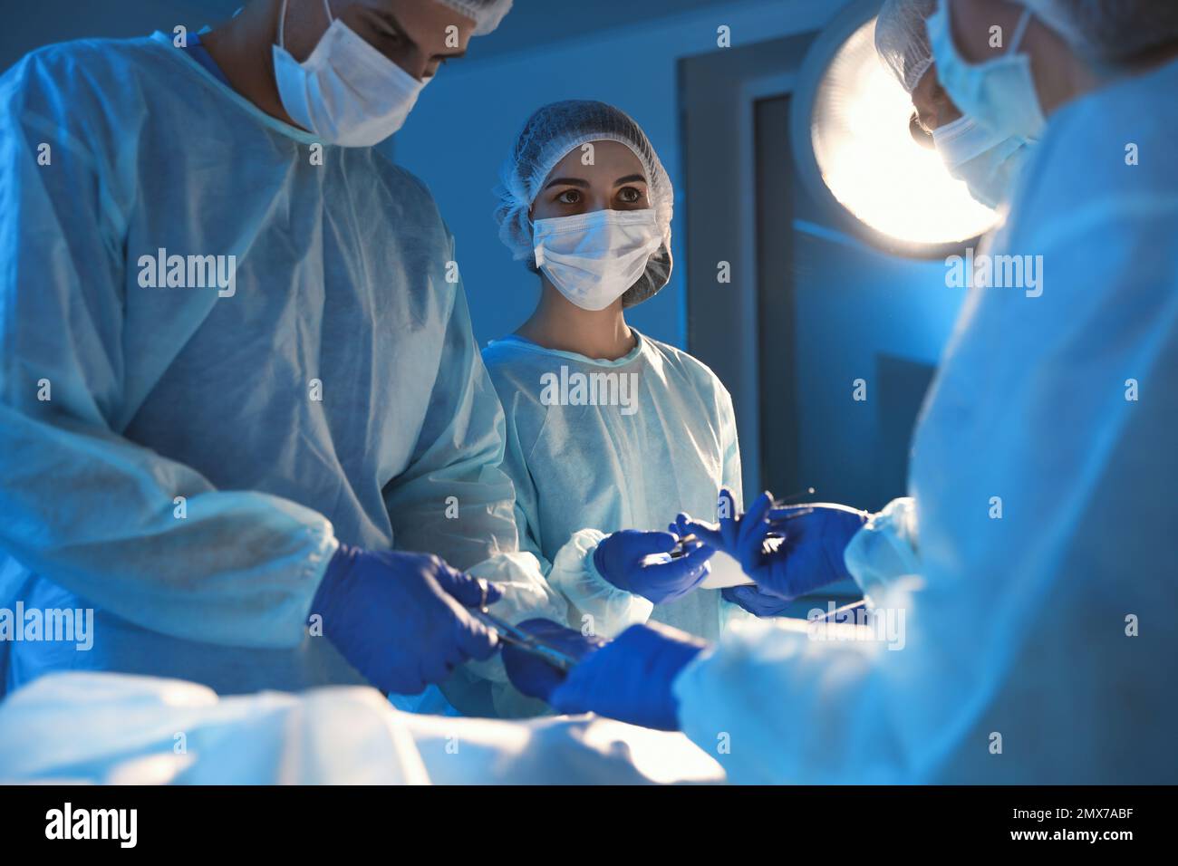 Team of professional surgeons performing operation in clinic Stock ...