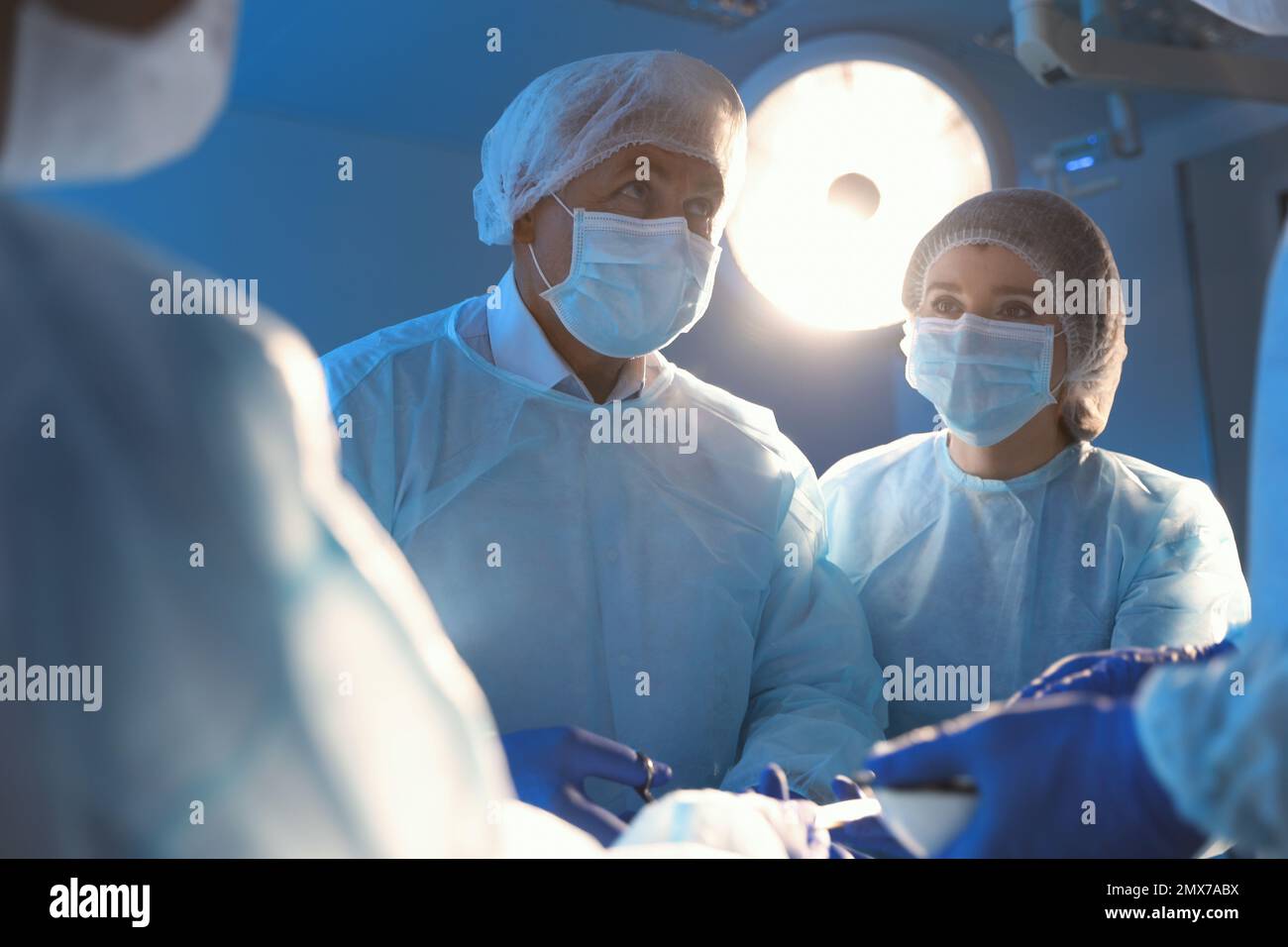Team of professional doctors performing operation in surgery room Stock ...
