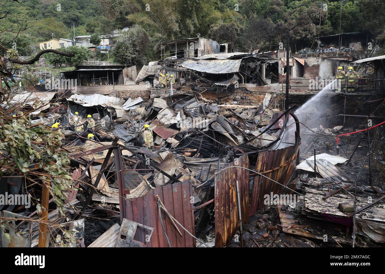 Firefighters rescue at a squatter huts at a village at Wang Lung Tsuen ...
