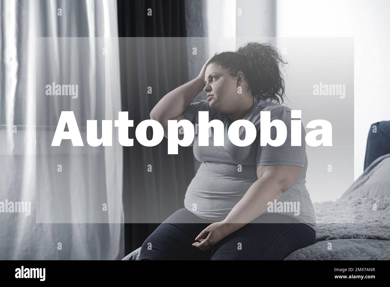 Depressed overweight woman sitting alone on bed at home. Autophobia ...