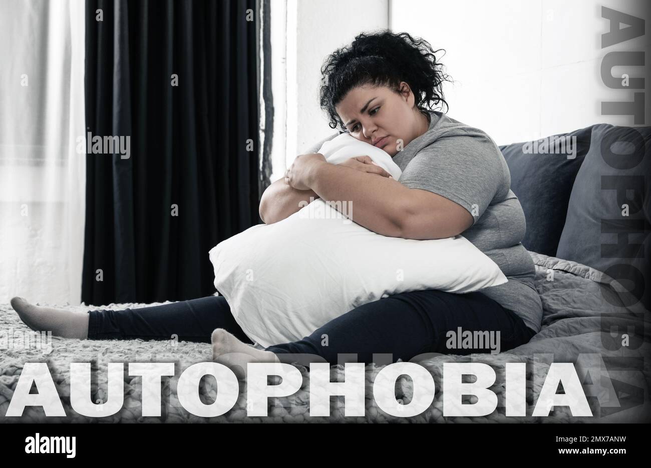 Depressed overweight woman sitting alone on bed at home. Autophobia ...