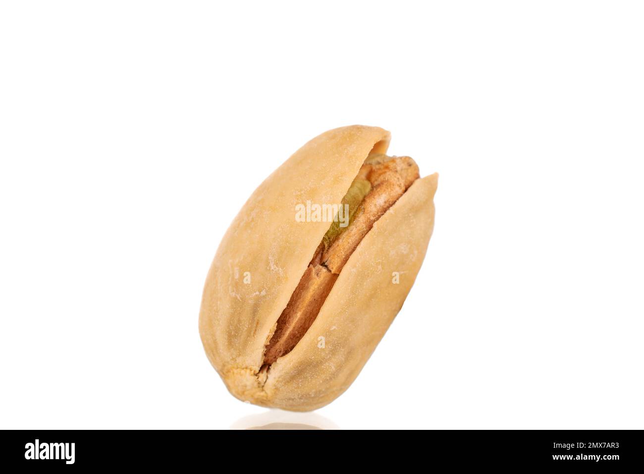 One unpeeled pistachio, close-up, isolated on white Stock Photo - Alamy