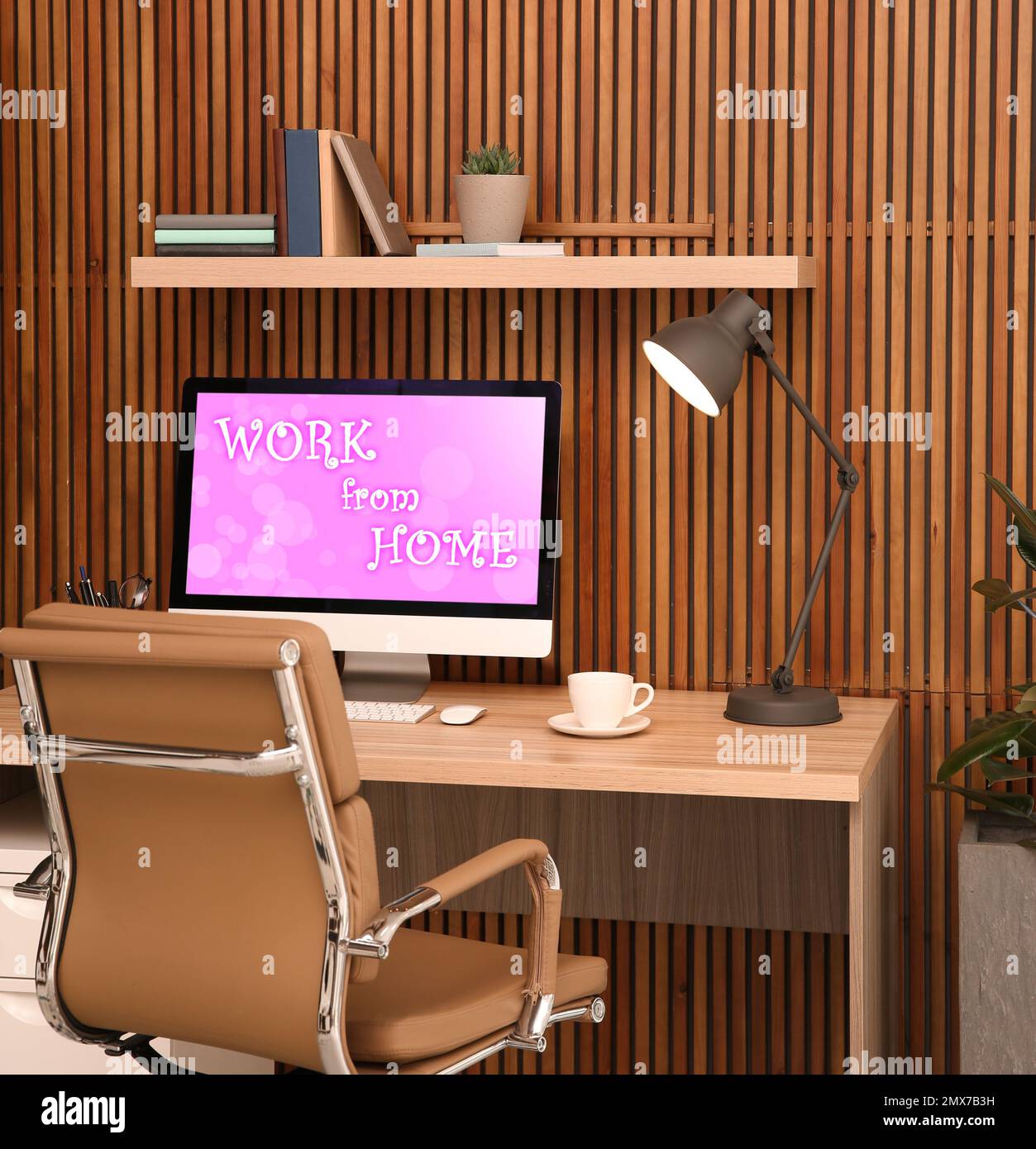 Modern computer with text WORK FROM HOME on table in office Stock Photo ...