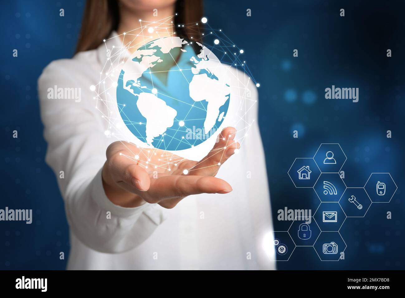 Travel agency services. Woman demonstrating world globe Stock Photo - Alamy