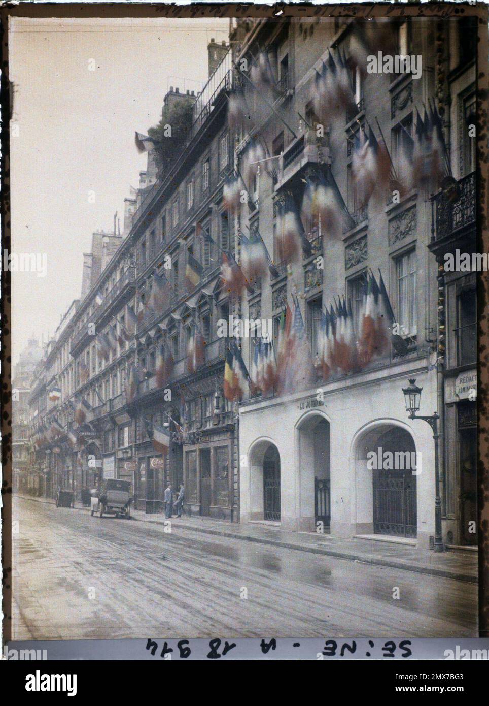 Paris (ie arr.), France rue de Richelieu decorated with flags, at the n ...
