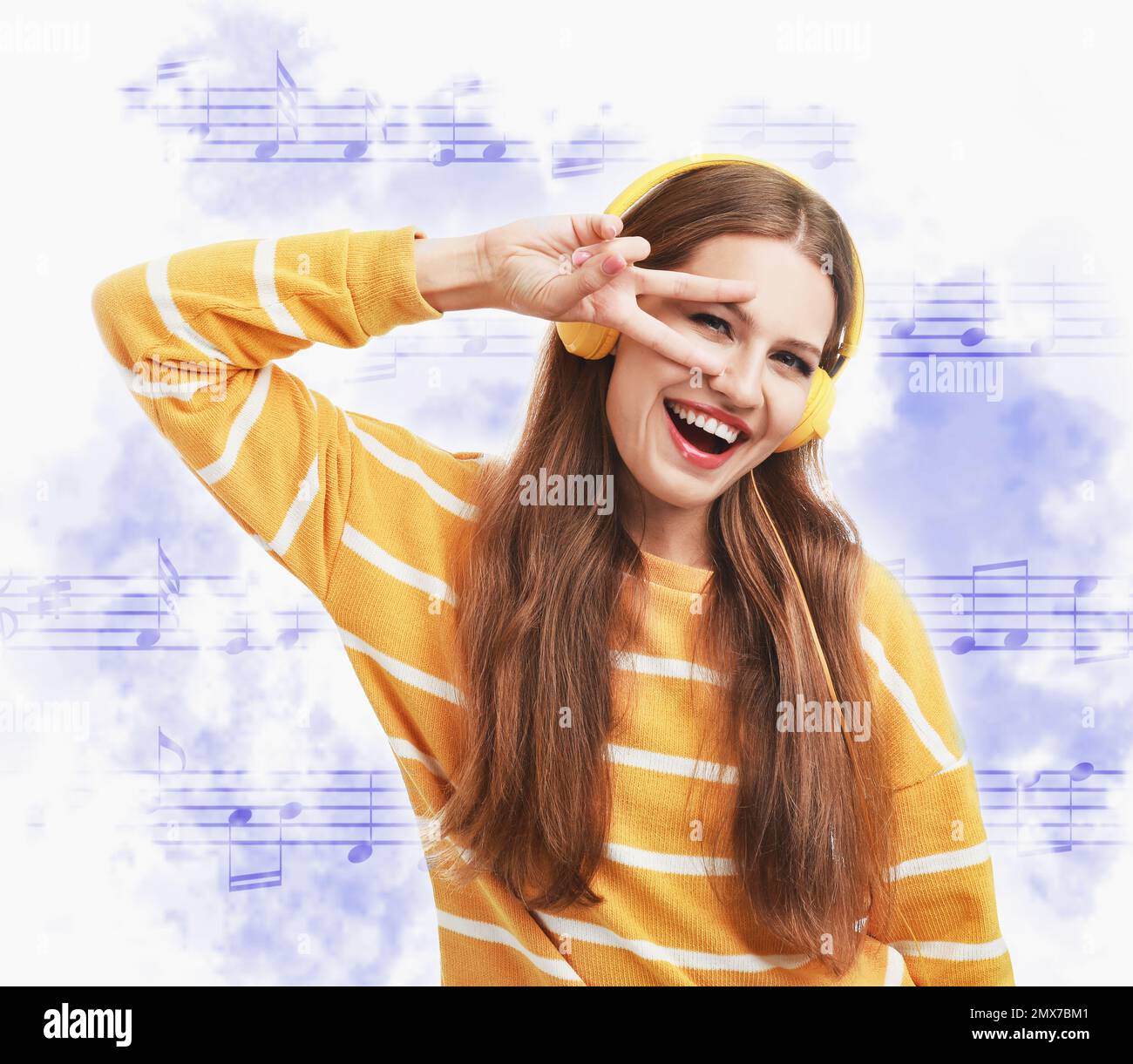 Young woman listening to music on color background with bright notes ...