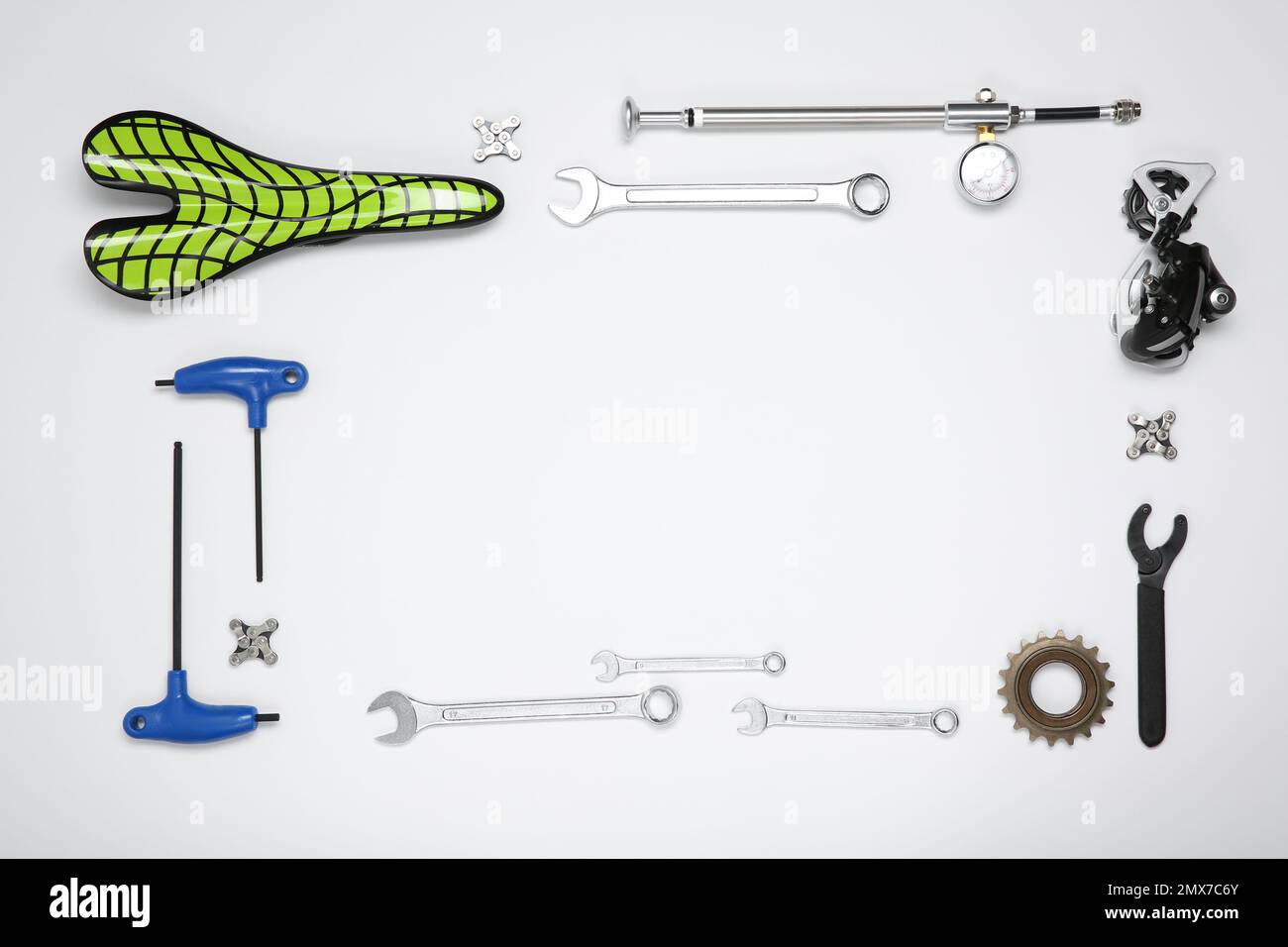 Set of different bicycle tools and parts on white background, top view ...