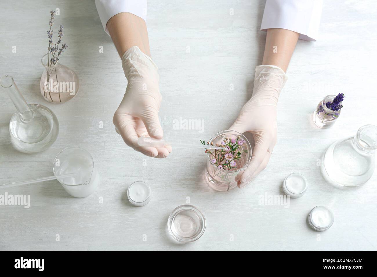 Scientist developing cosmetic product in laboratory, top view Stock ...