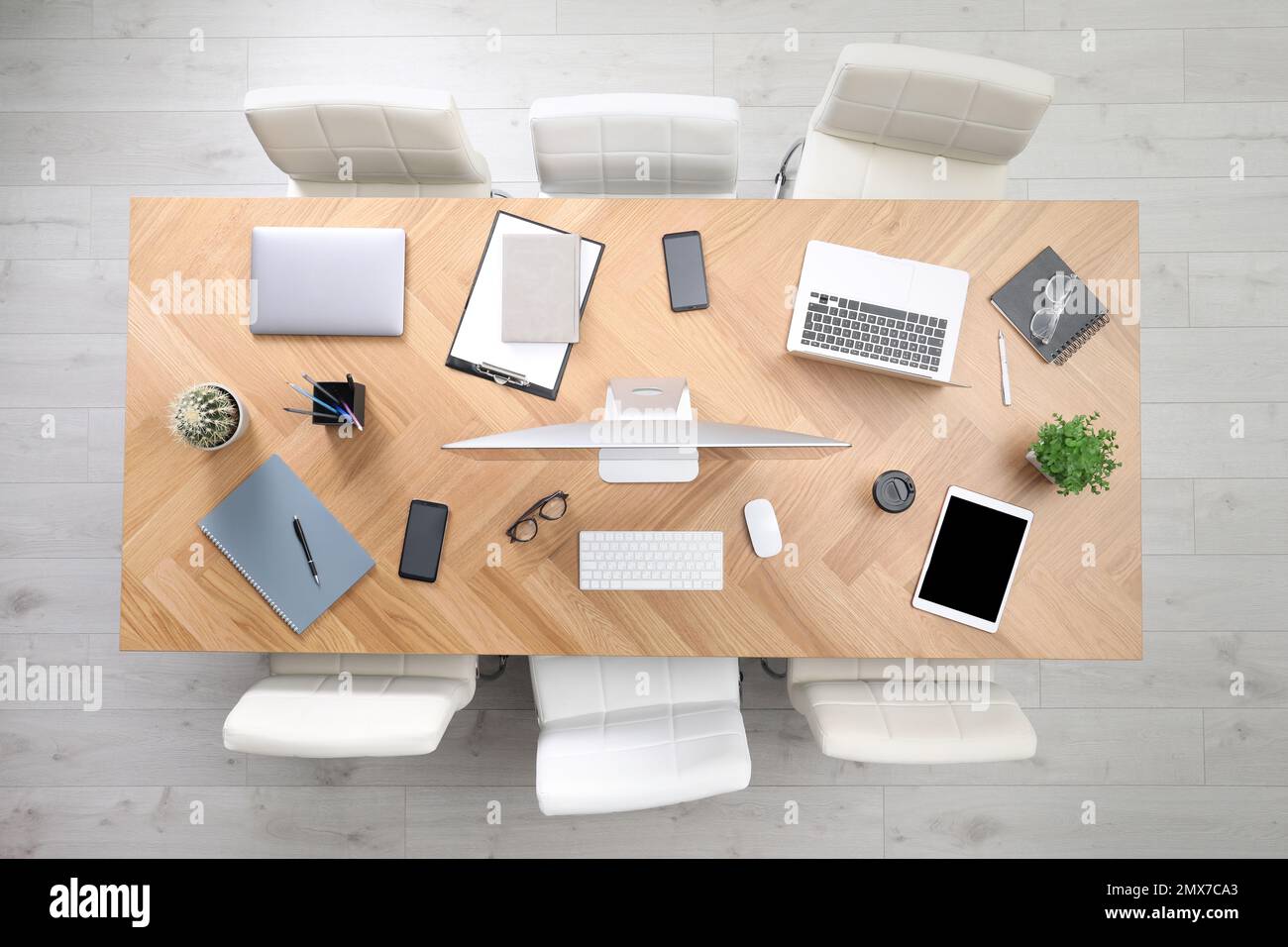 Modern office table with devices and chairs, top view Stock Photo - Alamy