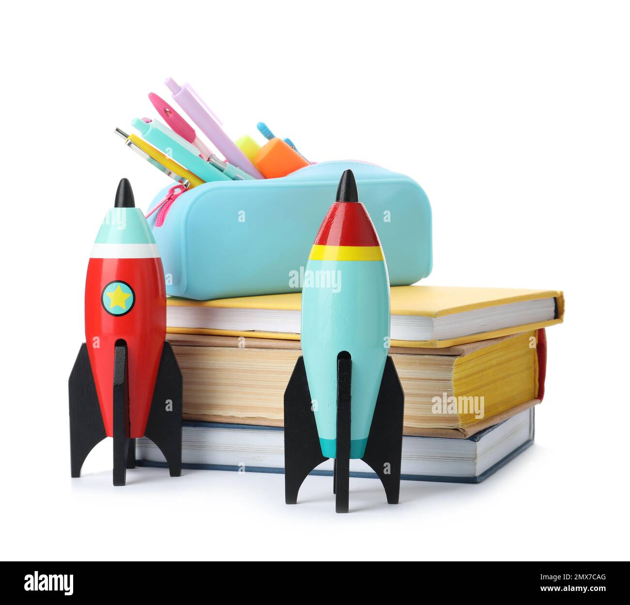 Bright toy rockets and school supplies on white background Stock Photo ...