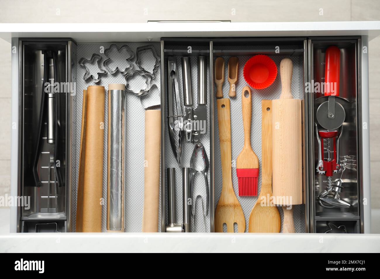 Different utensils in open desk drawer, top view Stock Photo - Alamy