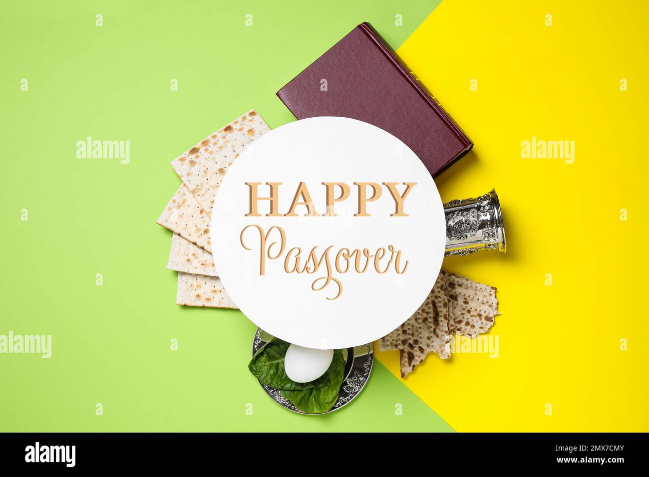 Symbolic Passover items and card on color background, flat lay. Pesah ...