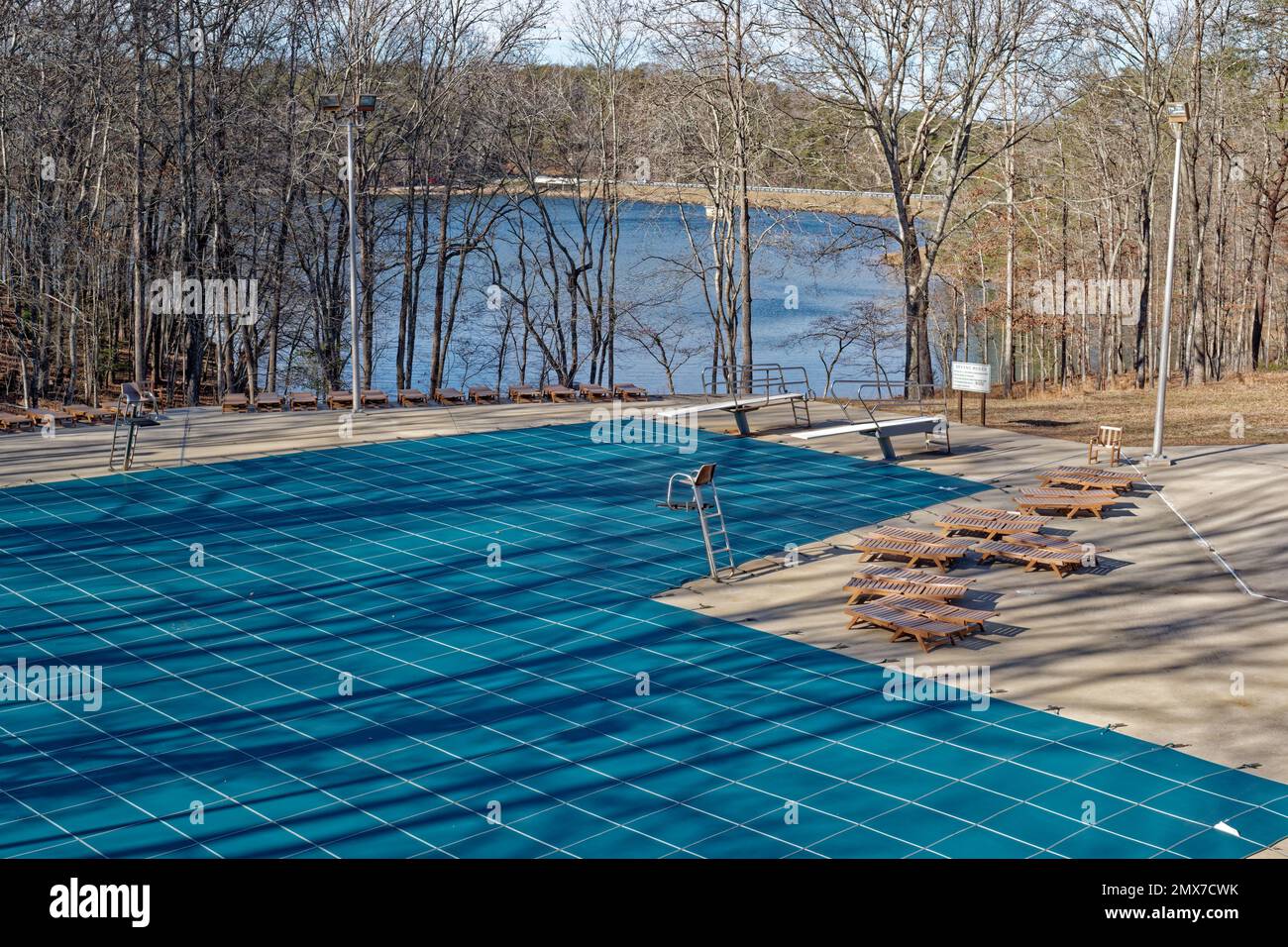 Closed for the season a public pool at a park with a cover over the ...