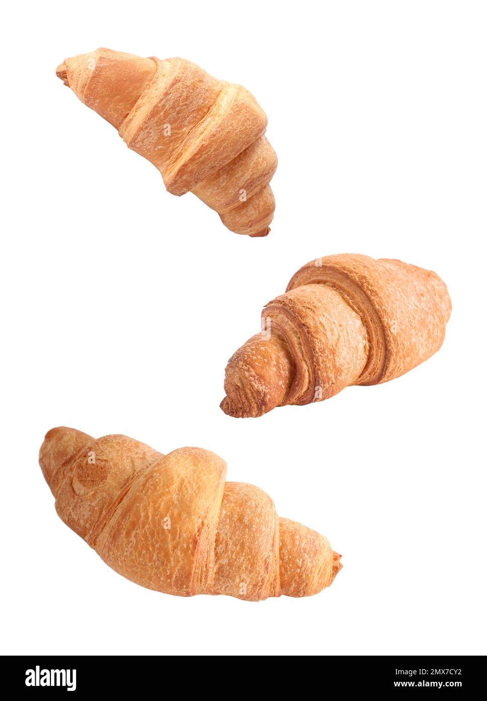 Falling delicious fresh baked croissants on white background. French ...