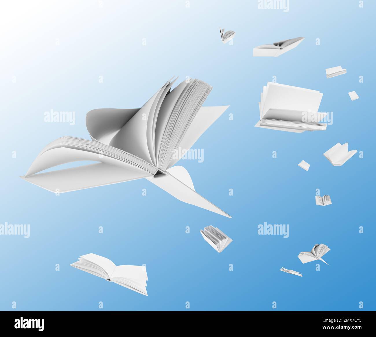 Many hardcover books flying on light blue background Stock Photo - Alamy