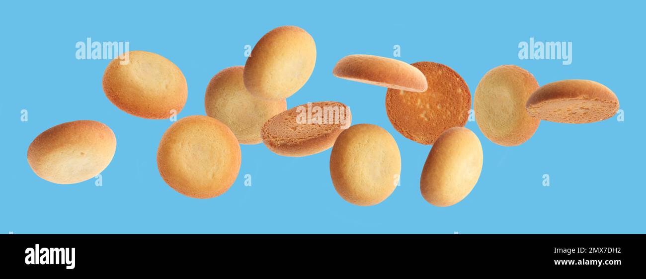 Set of falling delicious shortbread cookies on blue background. Banner ...