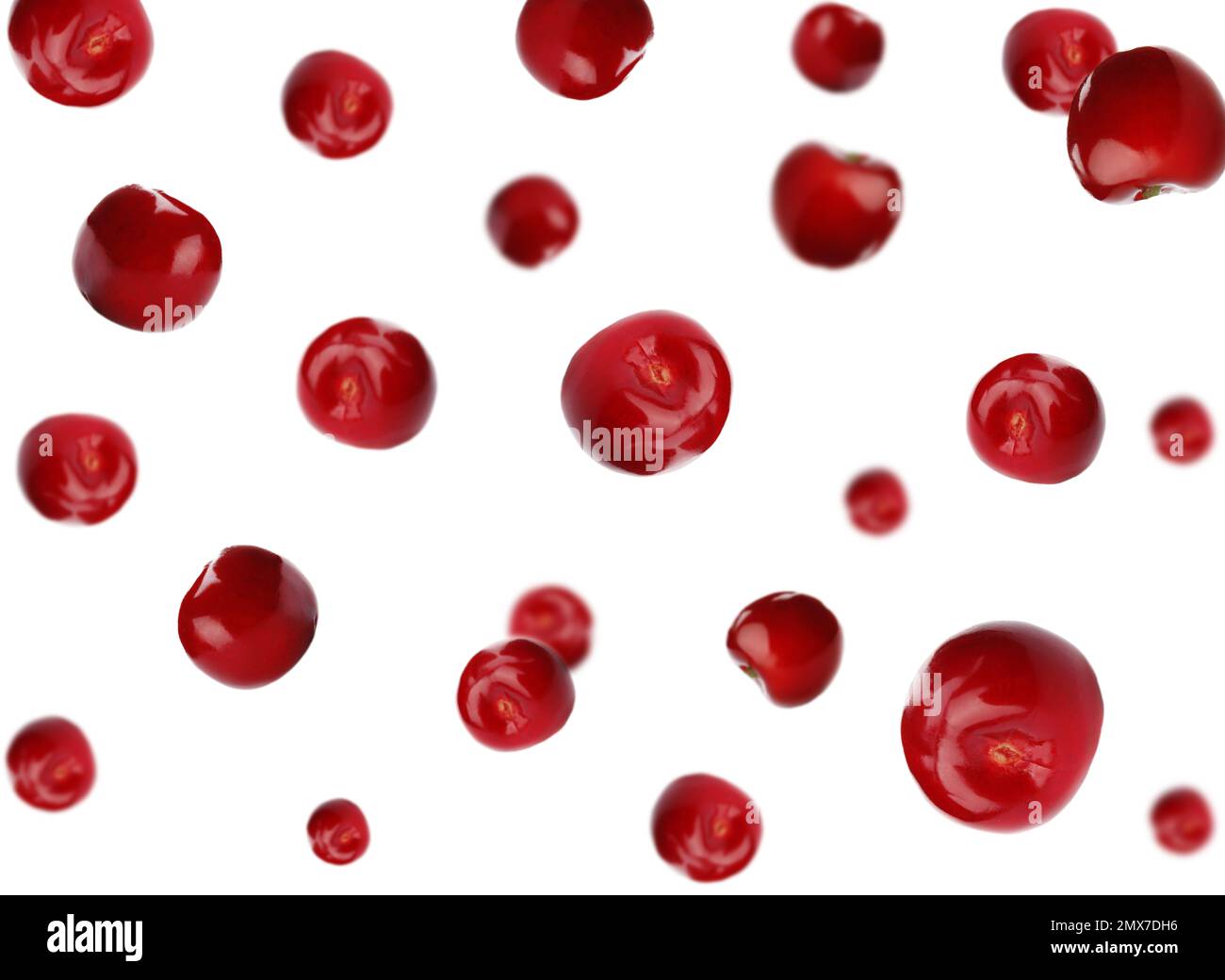 Fresh ripe cherries falling on white background Stock Photo - Alamy