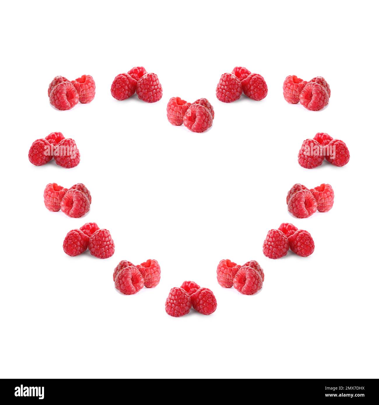 Heart made of ripe raspberries on white background Stock Photo - Alamy