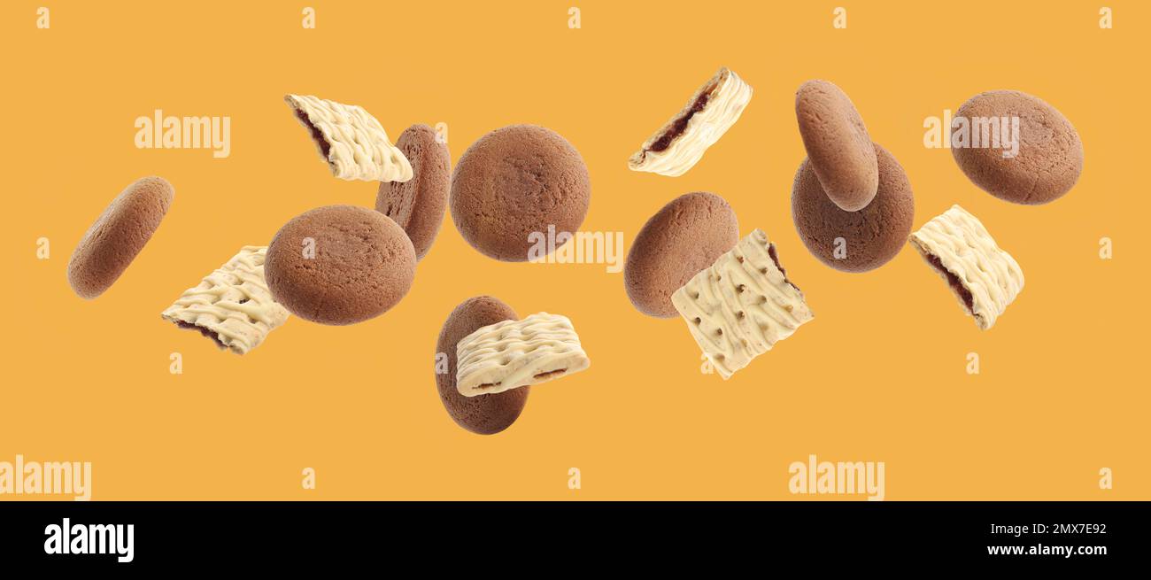 Set of different falling cookies on yellow background. Banner design ...