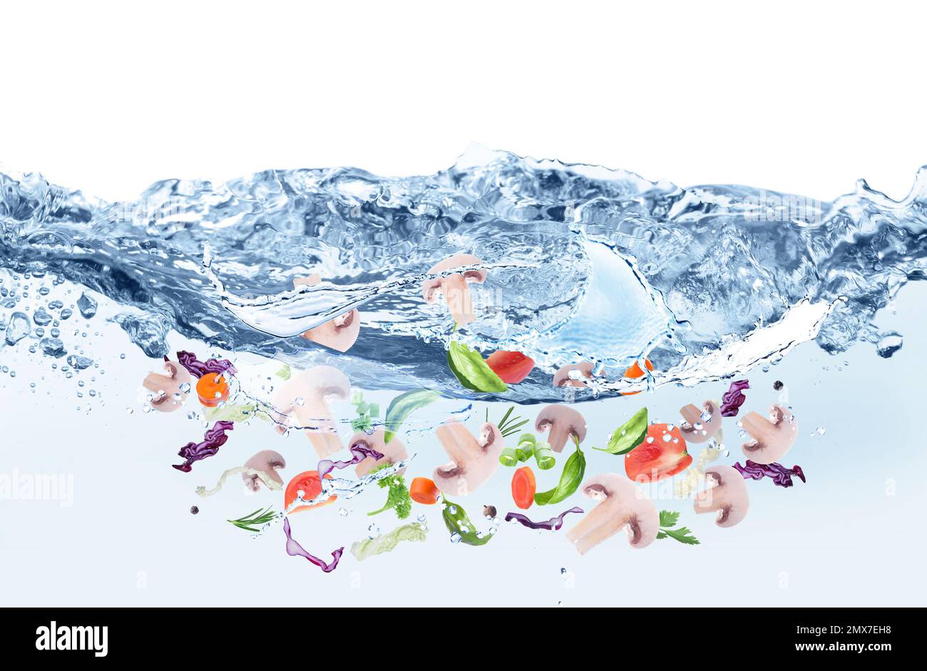 Many different ingredients in water with splashes. Soup recipe Stock ...
