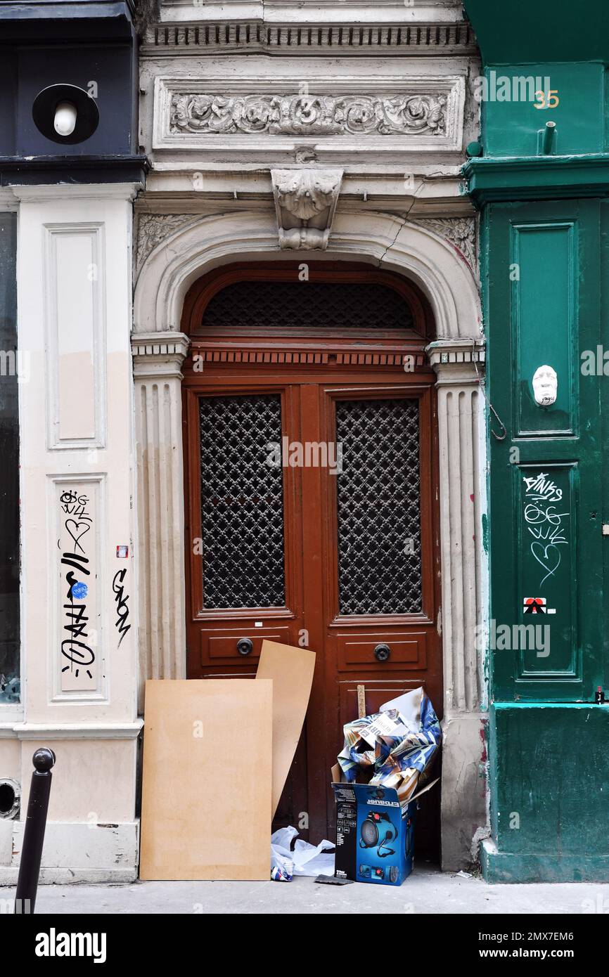 Garbage thrown in front of a 1880 building door in Paris - France Stock ...