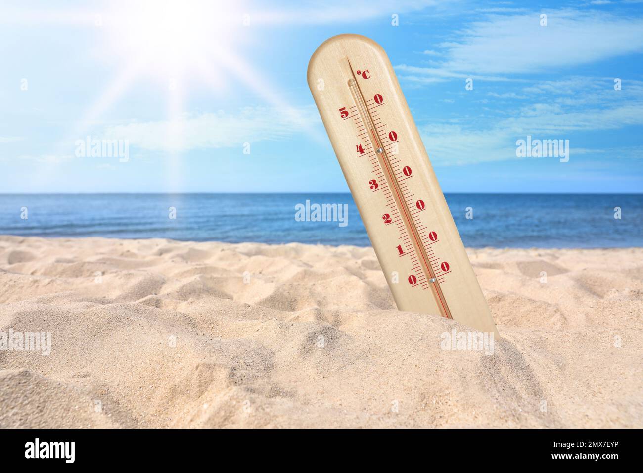 Weather thermometer with high temperature on sandy beach near sea Stock ...