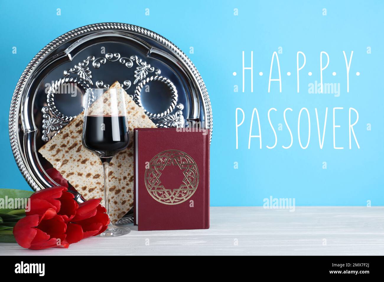 Symbolic Pesach (Passover Seder) items on white wooden table Stock ...