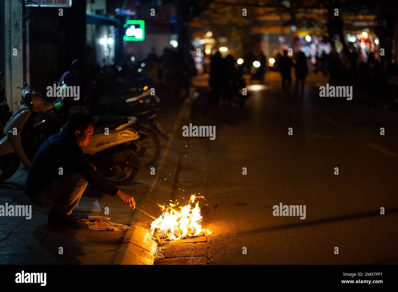 Burning trash in the public street at night - Hanoi - Vietnam Stock ...