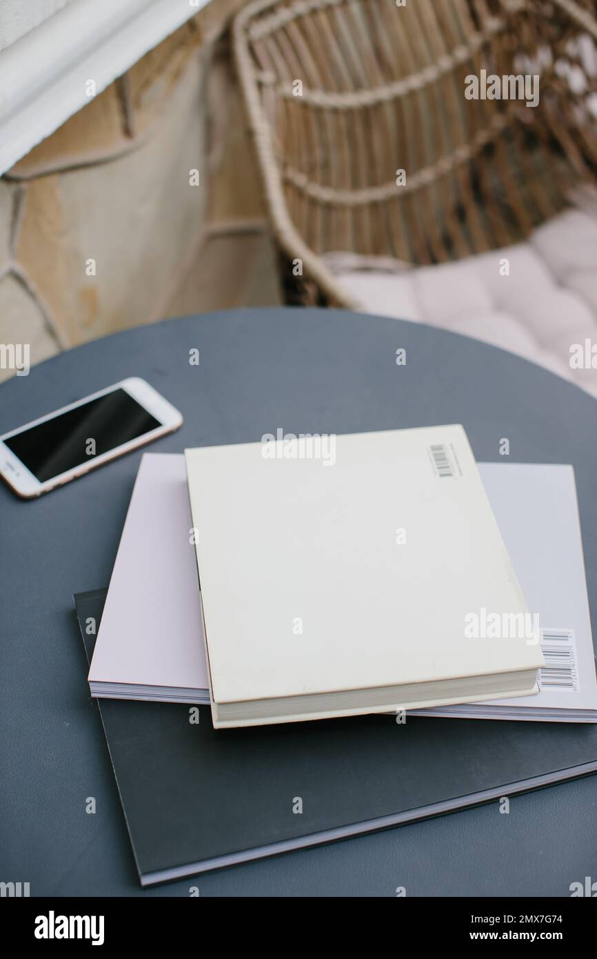 Mockup image magazine book and phone at the local table in the coffee ...