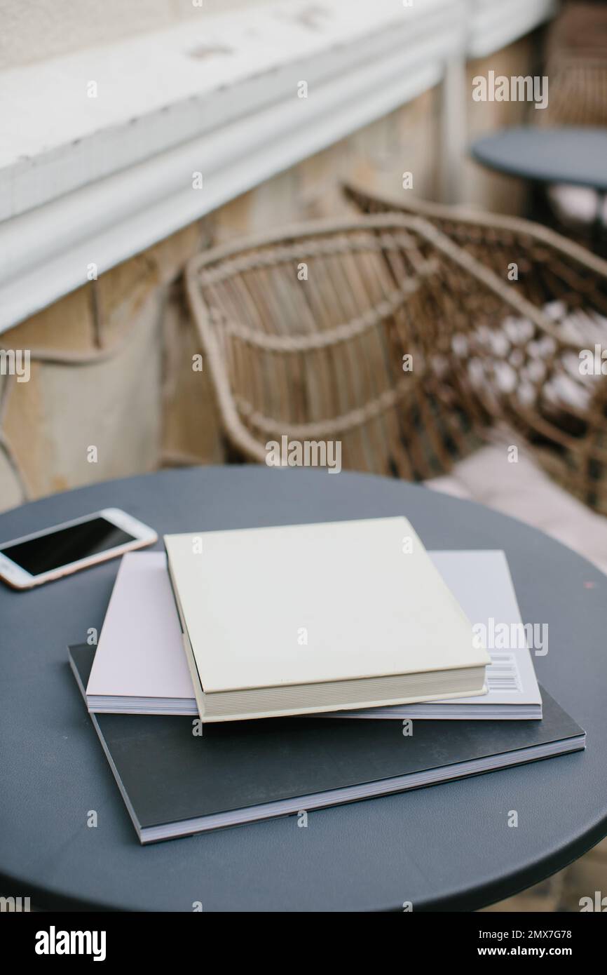 Mockup image magazine book and phone at the local table in the coffee ...