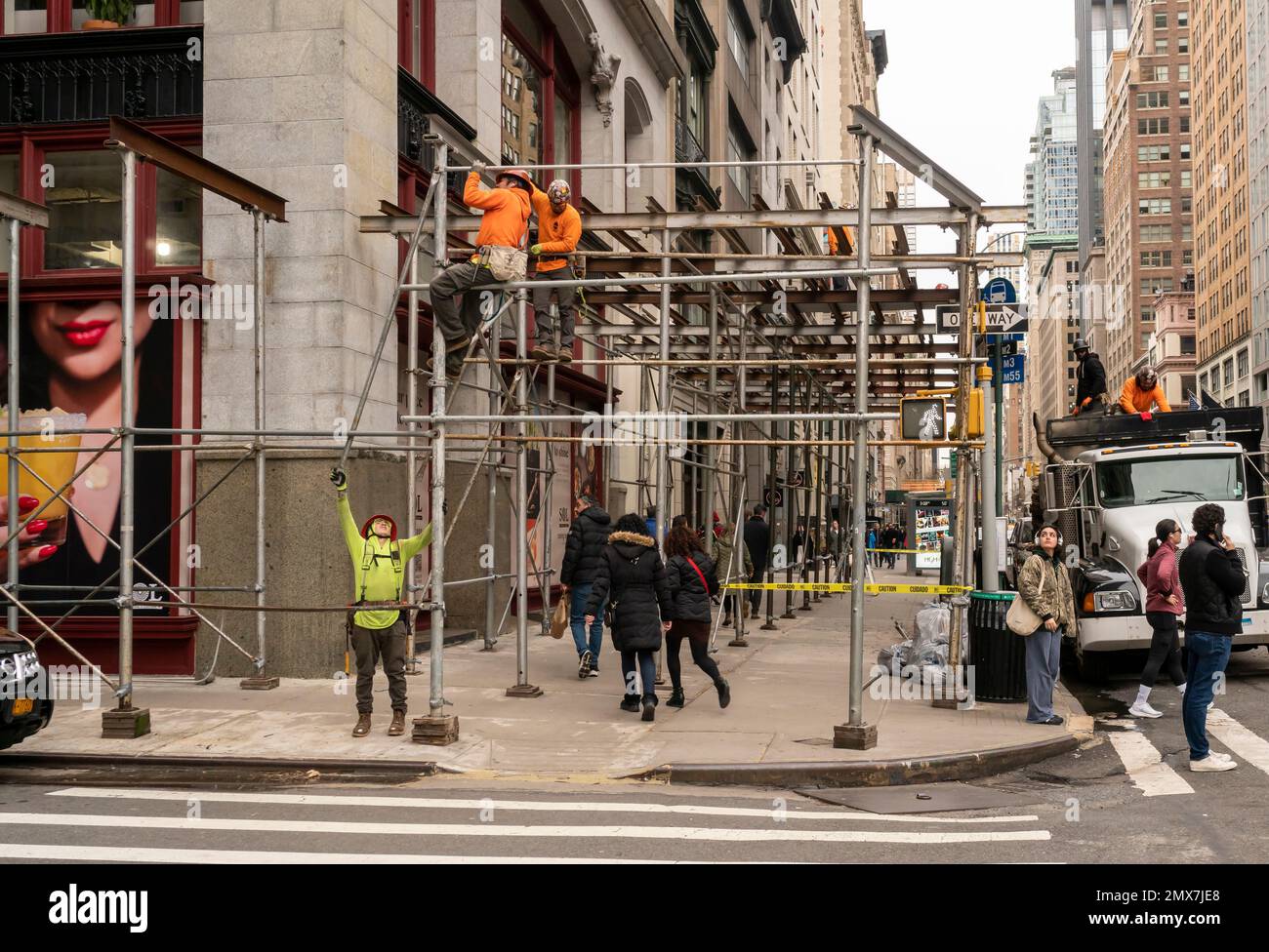 Workers construct scaffolding in the NoMad neighborhood in New York on ...