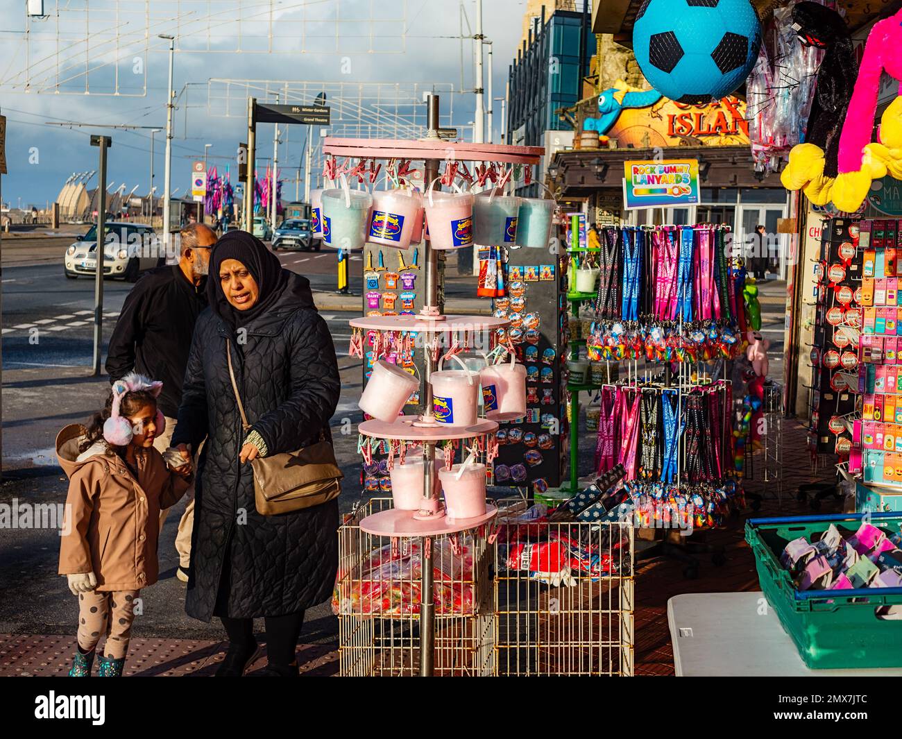 Asian family shopping at a seaside gift shop in Blackpool Stock Photo ...