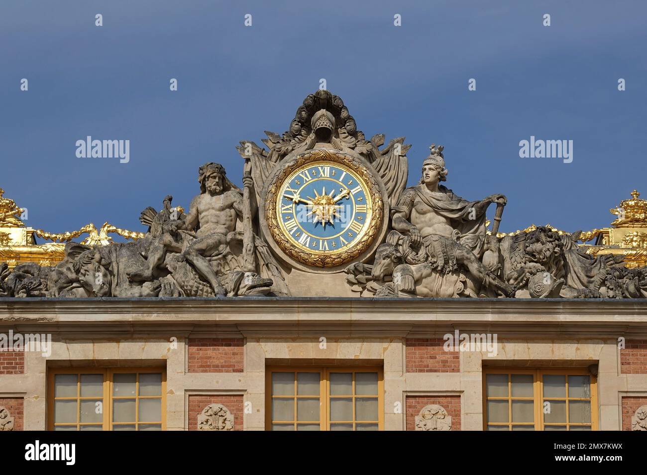 France, Versailles, Palace of Versailles, Detail of the clock on top of ...