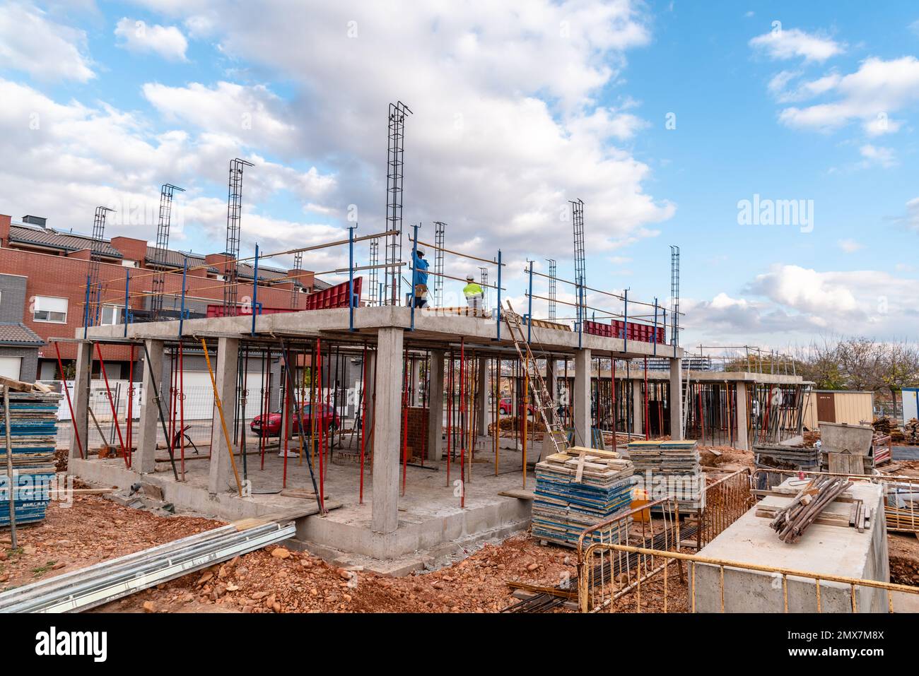 Construction site with steel formworks and reinforcing bars for pillars ...