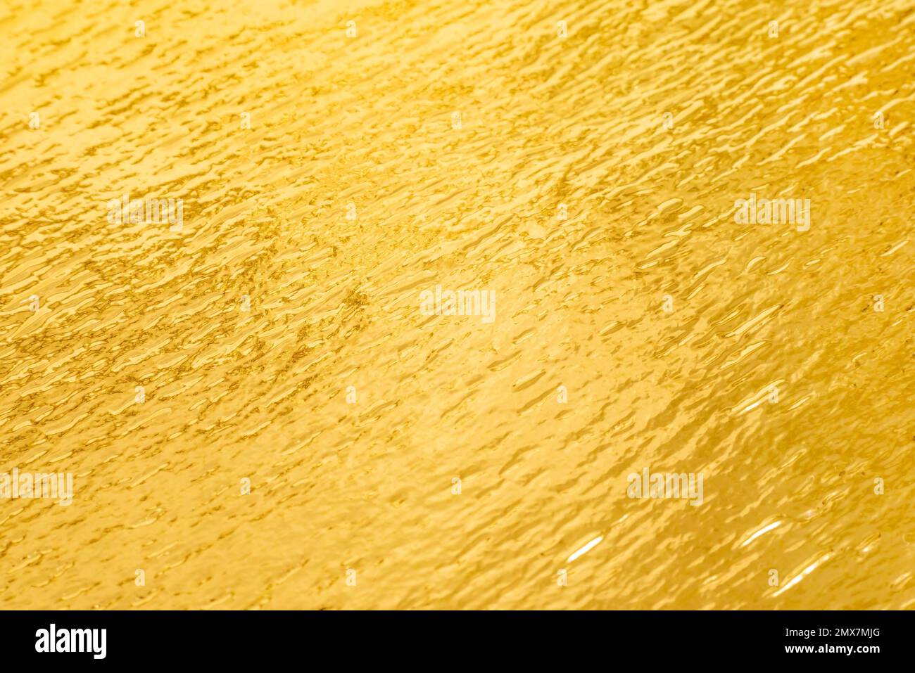 Golden background. Luxurious smooth shiny gold texture with fine ...