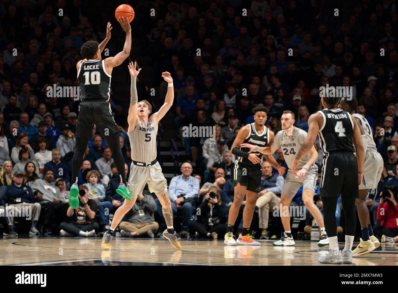 Providence guard Noah Locke (10) shoots against Xavier's Adam Kunkel (5 ...
