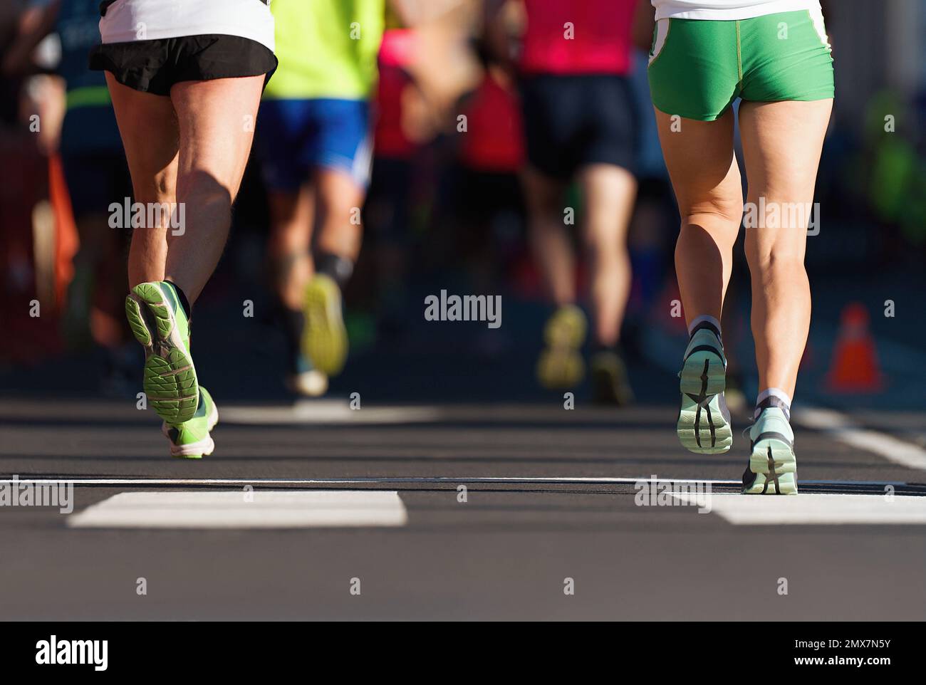 Marathon running race, people feet on city road Stock Photo - Alamy