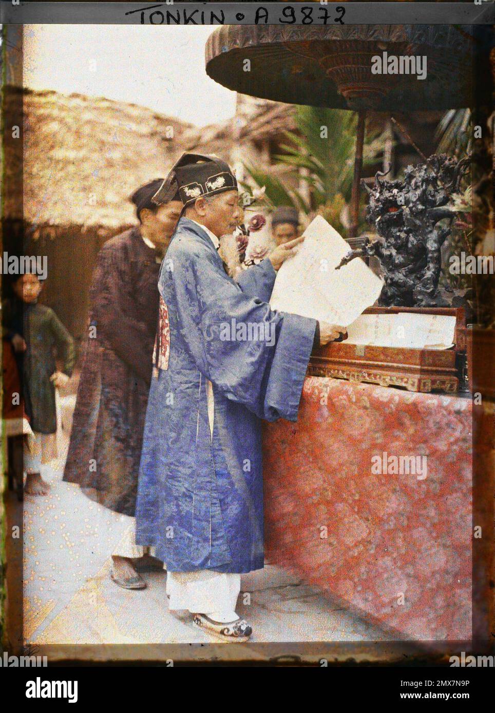 Nam-Giu, province of Hà-Dông, Tonkin, Indochine A canton leader reading ...
