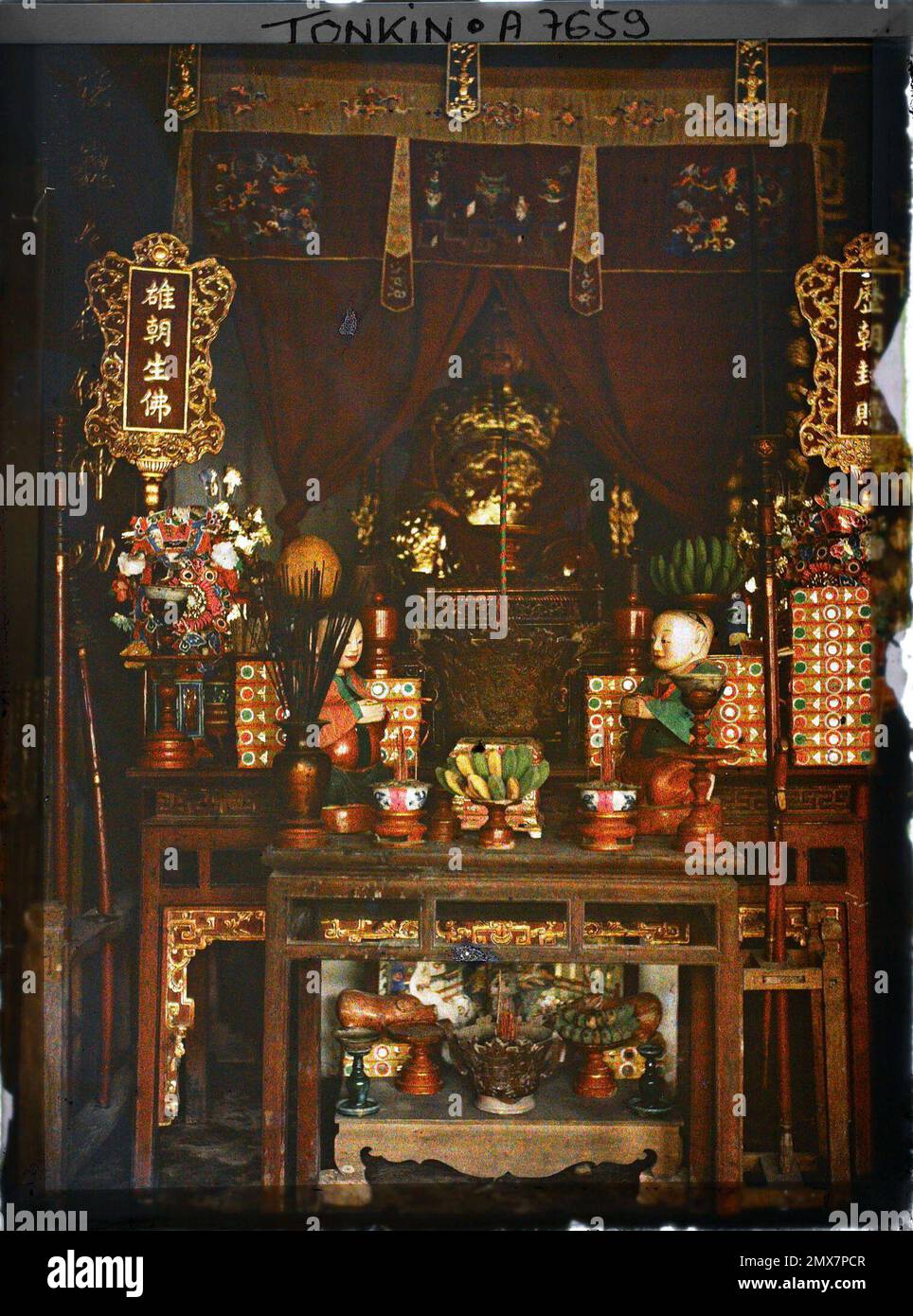 Hà-Noi, Tonkin, Indochina one of the side altars inside a Buddhist ...