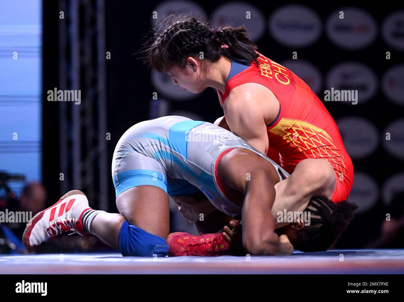 ZAGREB, CROATIA – FEBRUARY 02: Ziqi Feng of China (red) competes ...