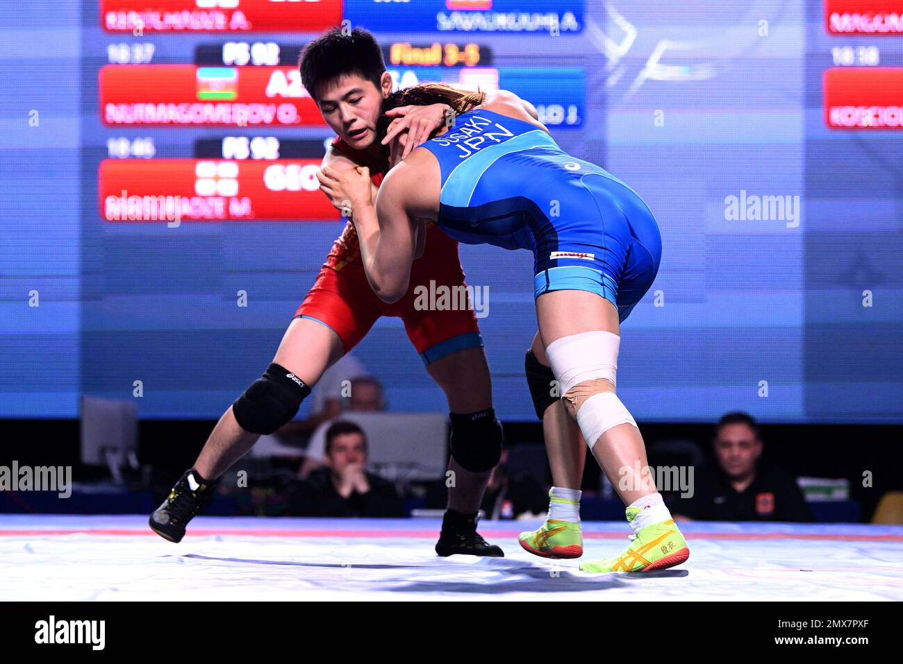 ZAGREB, CROATIA – FEBRUARY 02: Jiang Zhu of China (red) competes ...