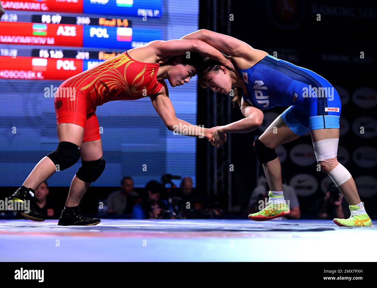 ZAGREB, CROATIA – FEBRUARY 02: Jiang Zhu of China (red) competes ...