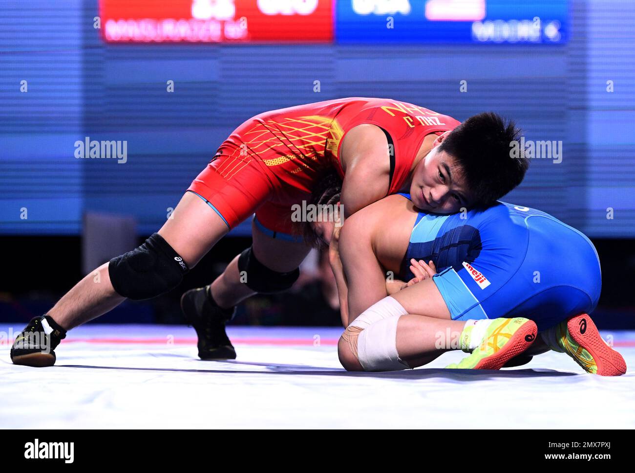 ZAGREB, CROATIA – FEBRUARY 02: Jiang Zhu of China (red) competes ...