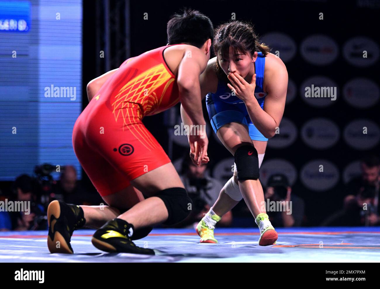 ZAGREB, CROATIA – FEBRUARY 02: Jiang Zhu of China (red) competes ...